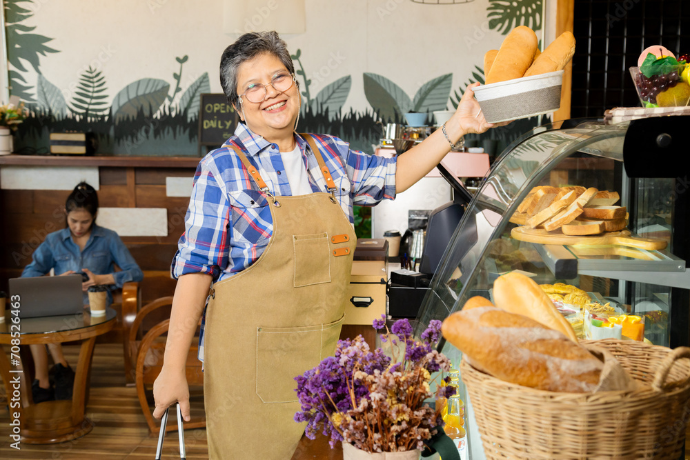 Asian 60s healthy senior waitress worker woman or bakery shop small ...