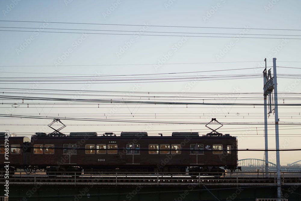 OSAKA, JAPAN - NOV 18, 2019: Hankyu railway train crossing the railway ...