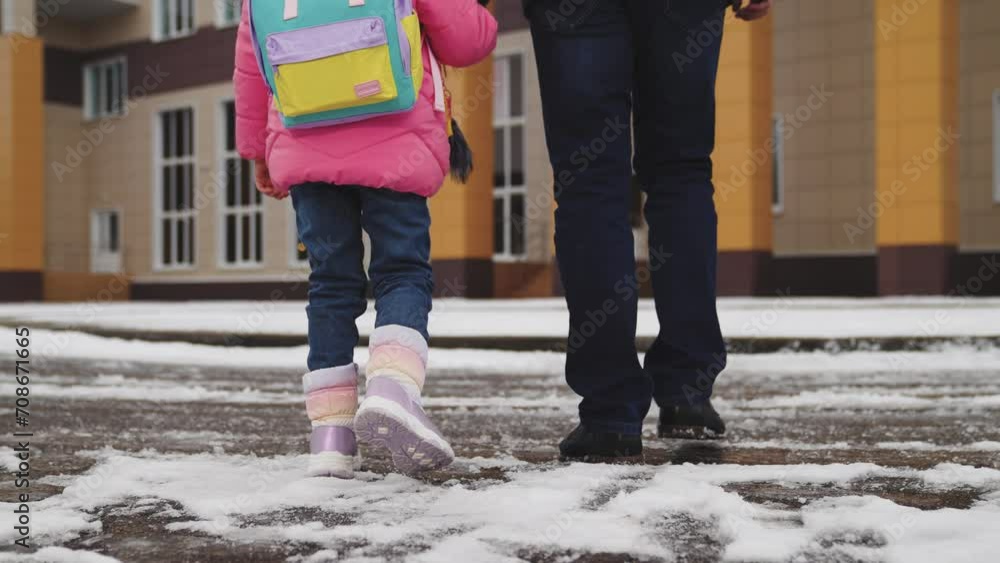 legs close-up, walking snow, child his father walk with their feet snow ...