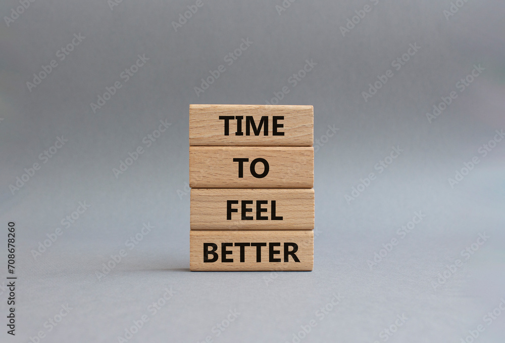 Time to feel better symbol. Wooden blocks with words Time to feel ...