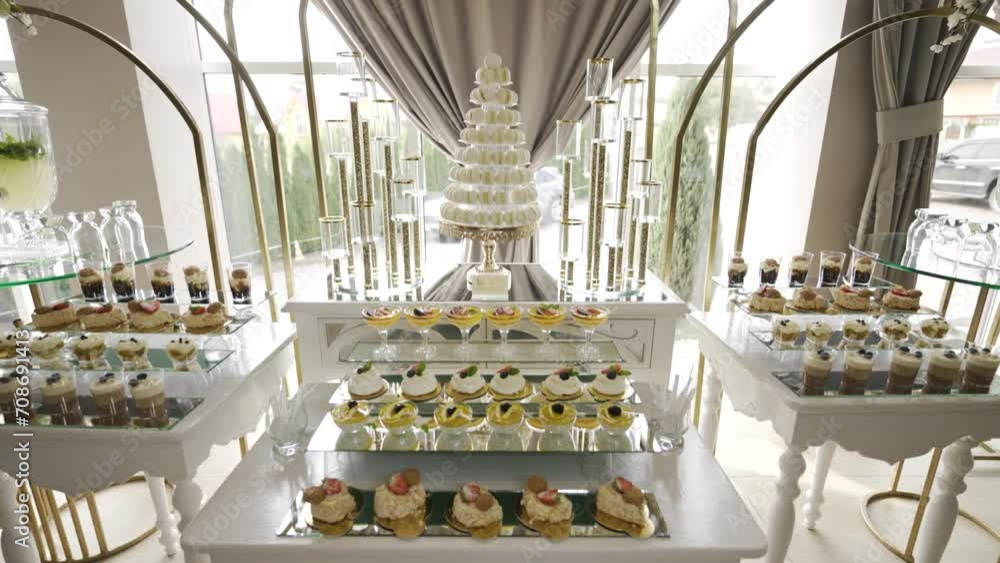 Elegant dessert table with a variety of sweets Luxurious setting with a ...