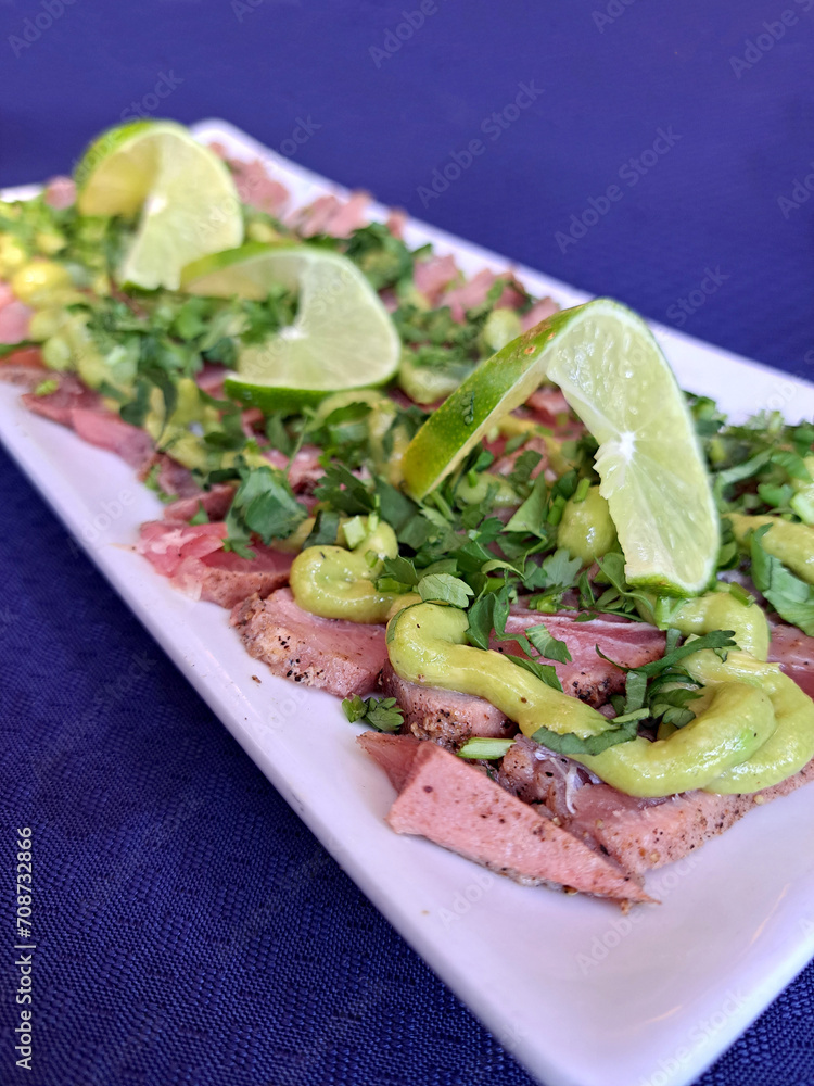 Tuna tiradito is a dish of Peruvian origin that consists of raw fish ...