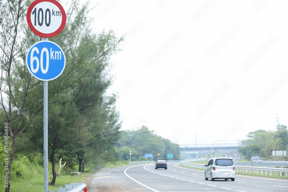Speed limit and minimum speed signs on Indonesian toll roads. The ...