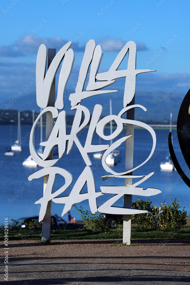 Photograph of a vertical poster with corporeal letters with the name of ...