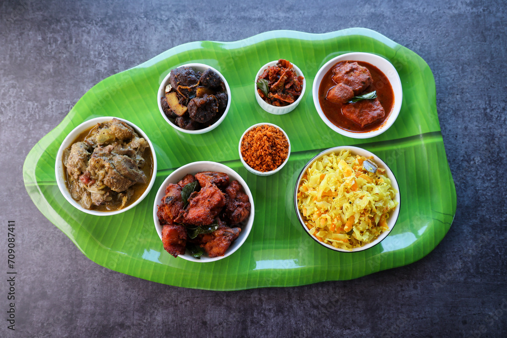 Kerala special food sadhya in banana leaf plate with Chicken fry Duck ...