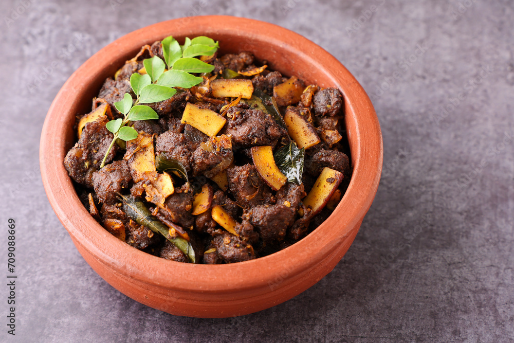 Spicy red beef fry curry and brown rice South Indian dish Kerala, India ...