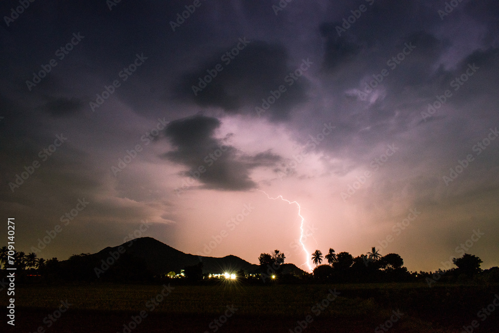 Witness the power of nature as a mesmerizing lightning bolt cuts ...
