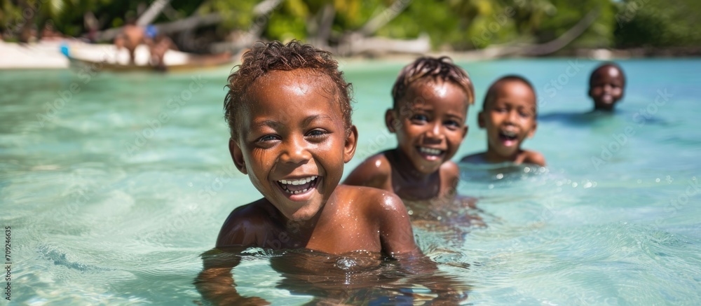 Children in the remote village in the Solomon Islands play in the ...