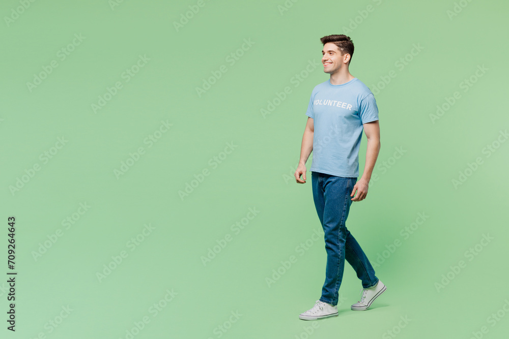 Full body side profile view happy smiling fun young man wear blue t ...