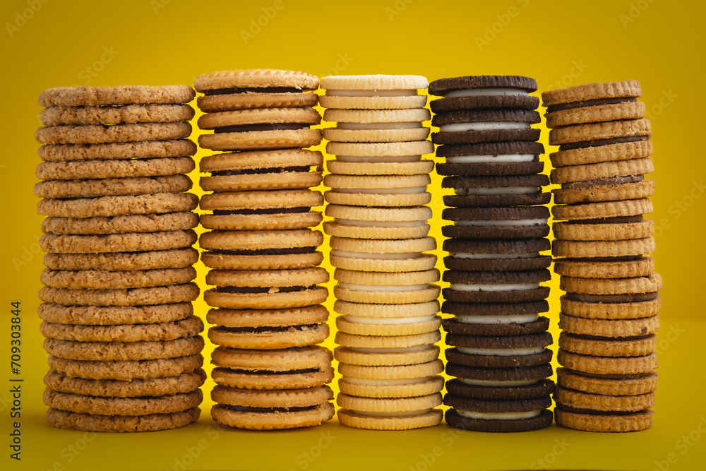 Biscuits of different colors photographed on top of each other with ...