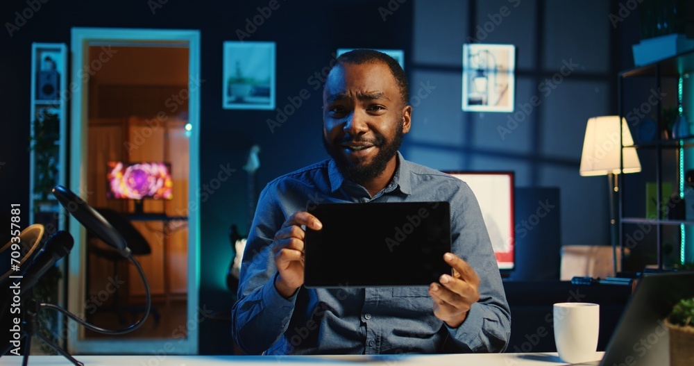 Content creator filming tech review of newly launched tablet, unboxing ...