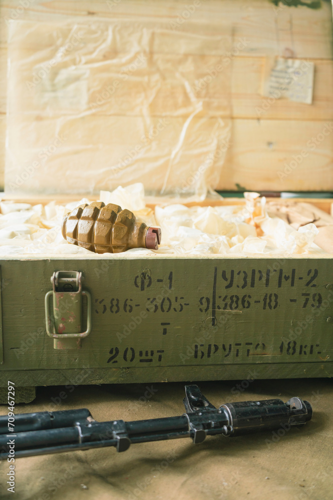 F-1 combat defensive grenade, a box of grenades and a Kalashnikov ...