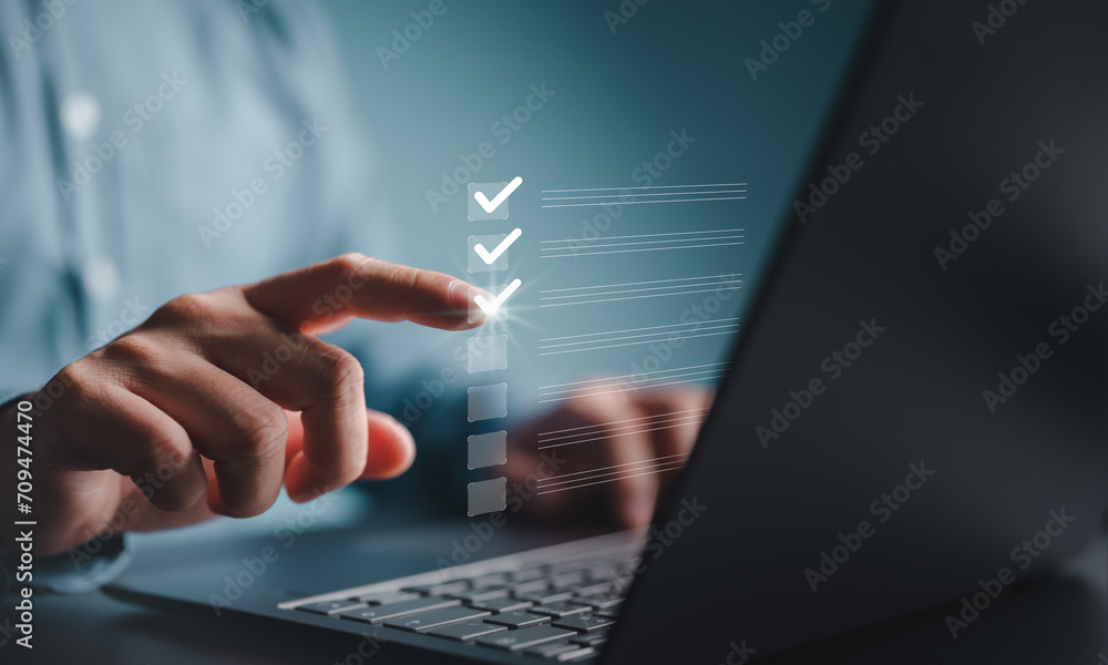 Businessman marks checkboxes. The survey form, check marks on a ...