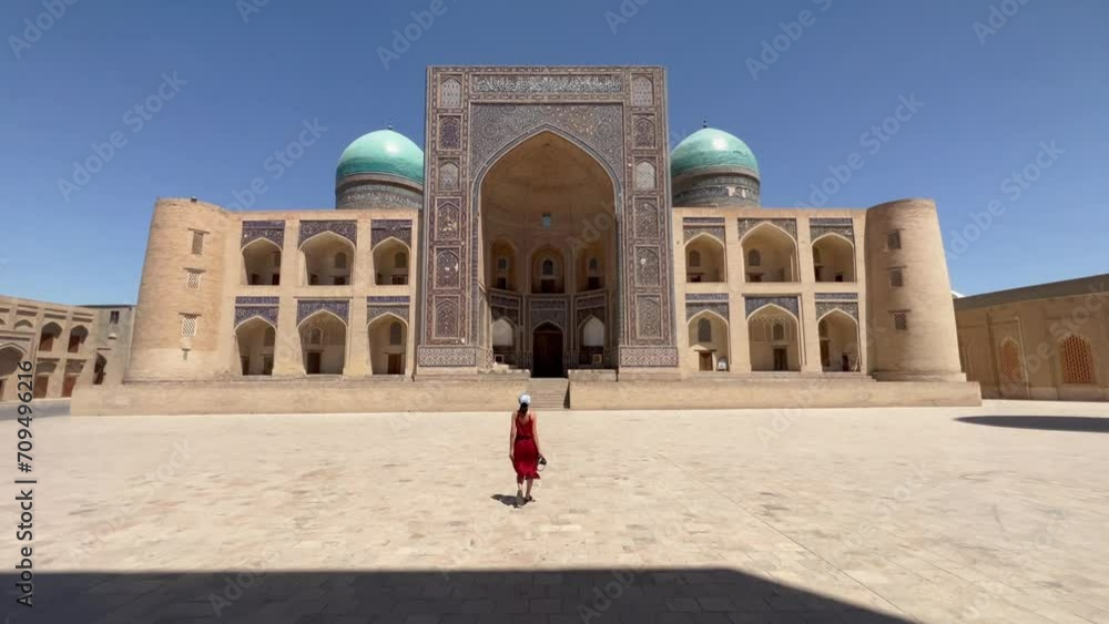 4K Gimbal Shot: Young Woman Approaching Mir-i-Arab Madrasa, a UNESCO ...