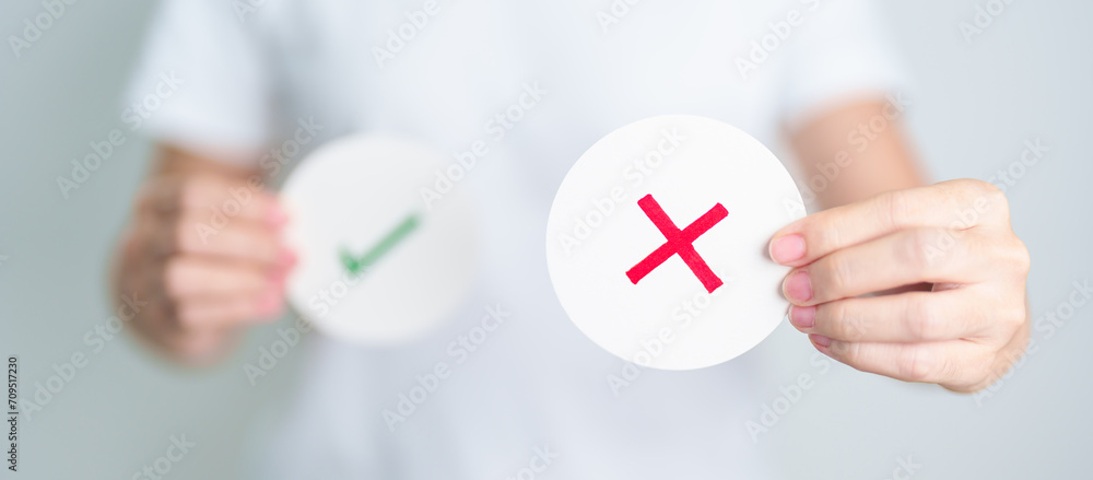 Woman show Wrong symbol paper. True and false, accept and rejected ...