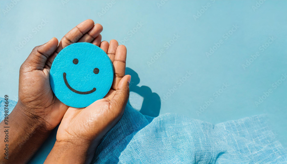 Hands holding blue happy smile face, good feedback rating, positive ...