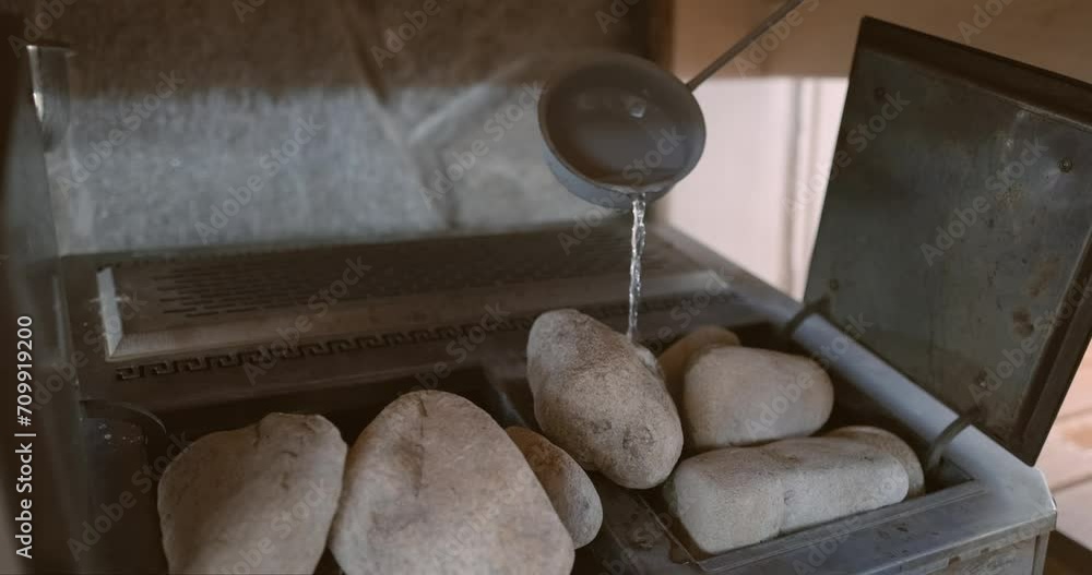 Vidéo Stock Depth of field close up, hot sauna rocks steam when water ...