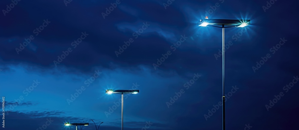 Contemporary urban street lights powered by electricity, shining ...