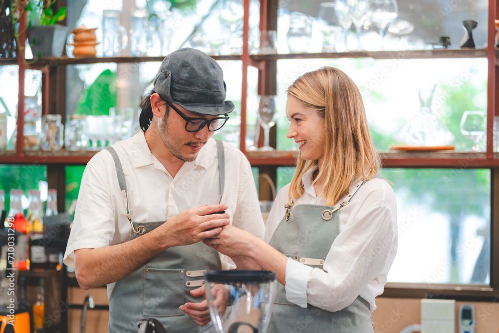Coffee shop small business shop owner couple or partner wearing apron ...