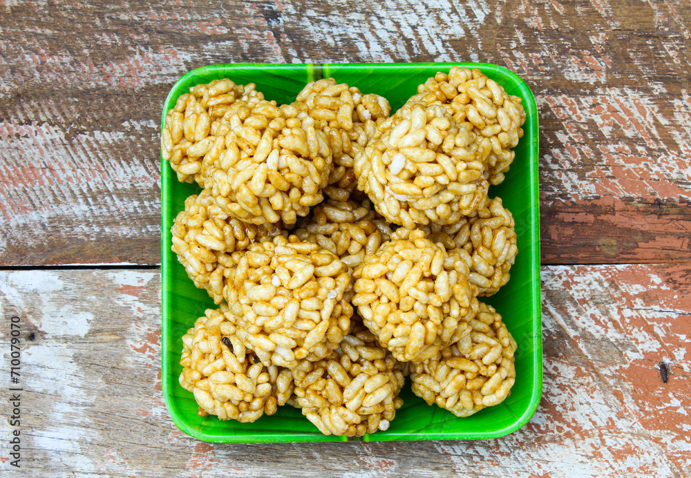 Murmura laddu puffed rice laddu in a plate on wooden background Stock ...