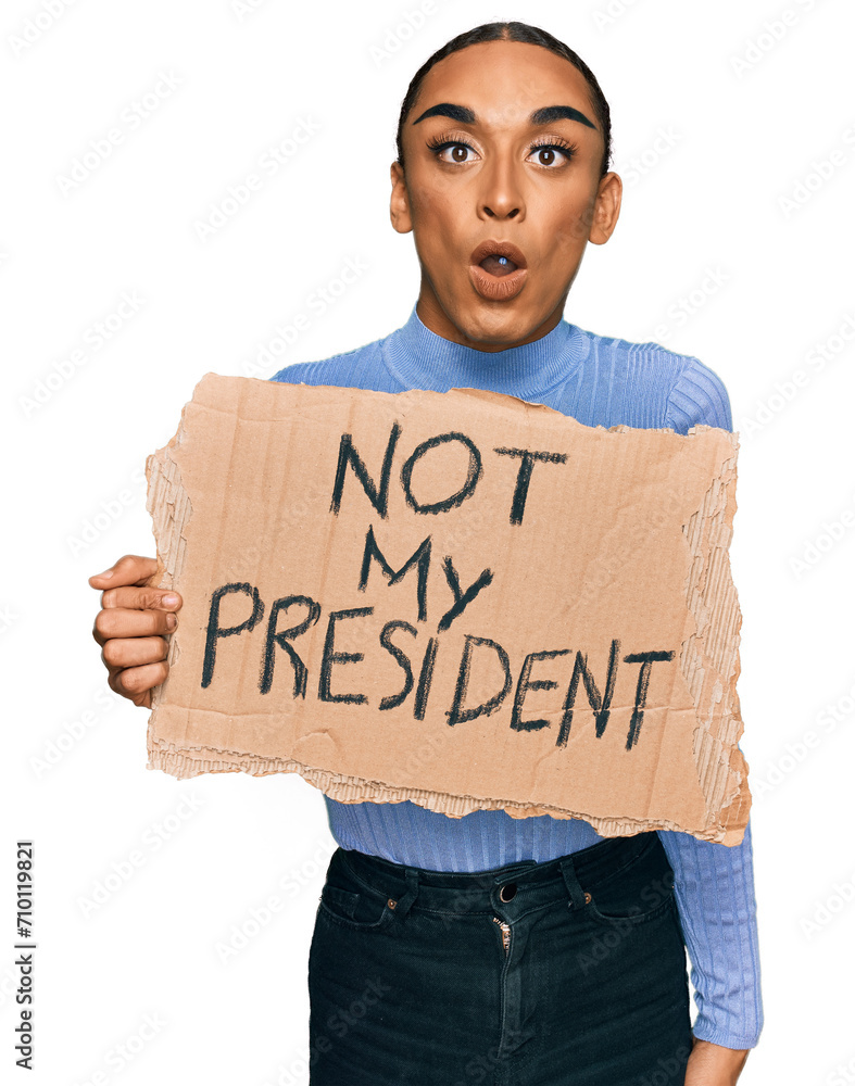 Hispanic transgender man wearing make up and long hair holding not my ...