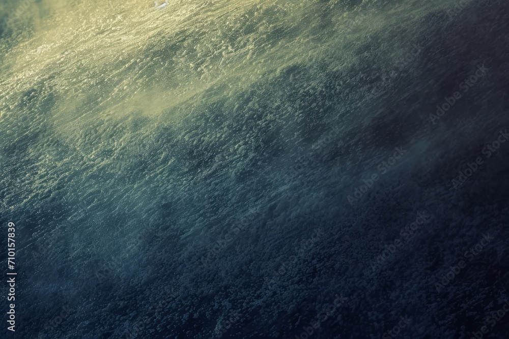 dynamic texture of a rough sea from above, with the sunlight filtering ...