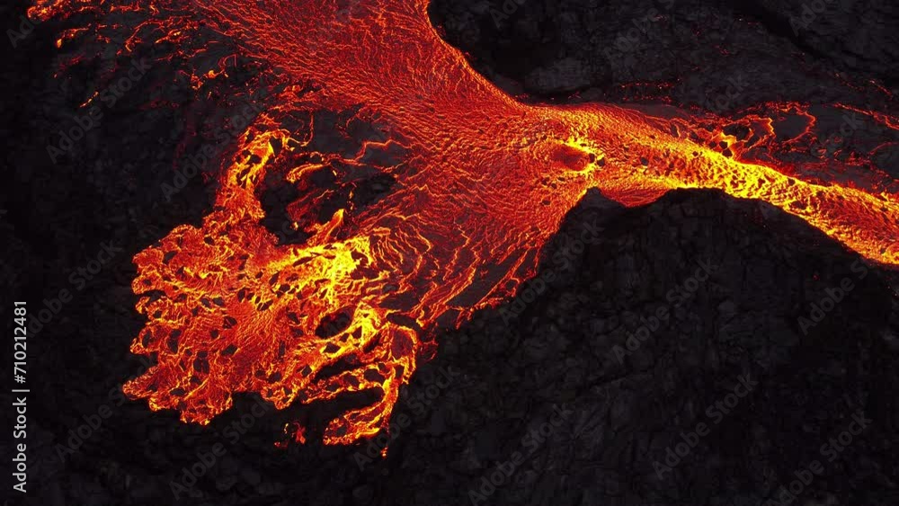 Lava river from active volcano. Red hot burning lava erupts from ground ...