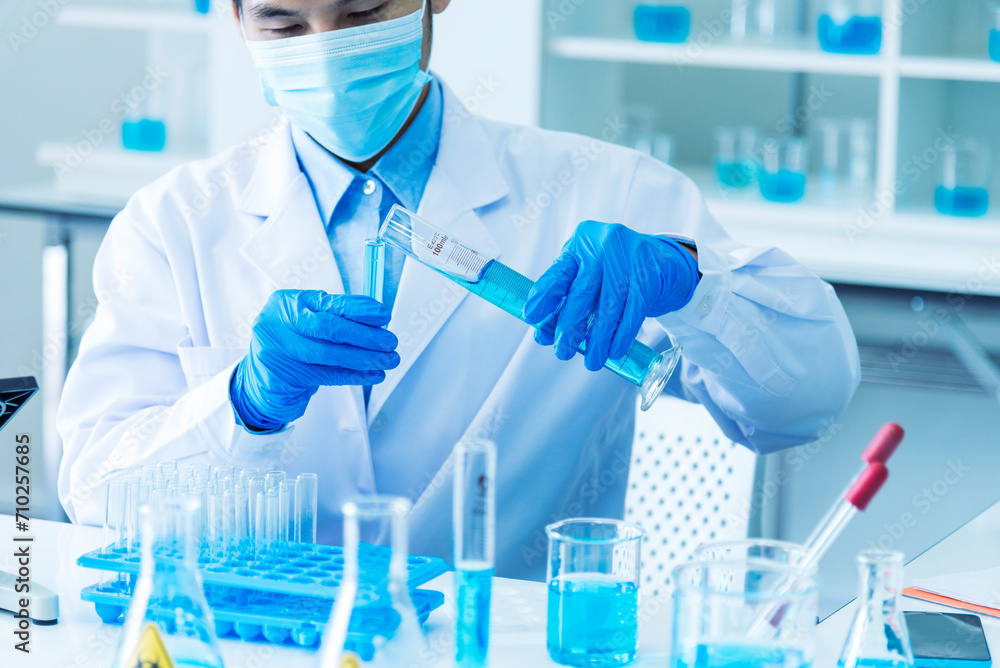 Scientist man holding sample blood test tube in science laboratory ...