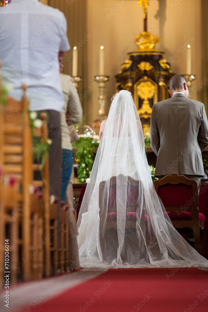 This photograph captures a poignant moment during a wedding ceremony ...