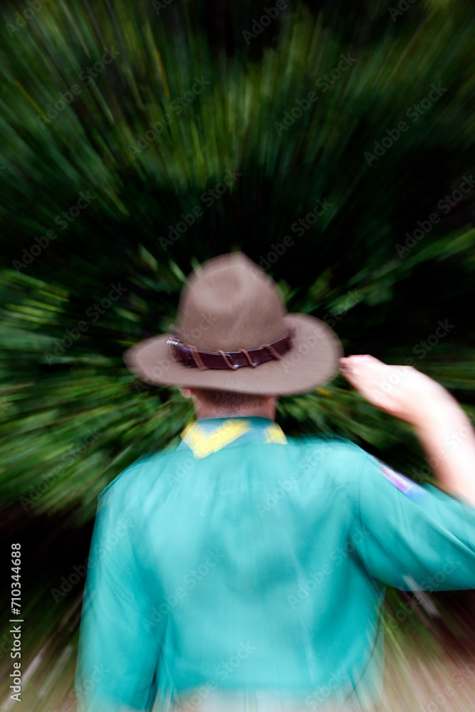 Boy scout in uniform performs three finger salute. Scout symbol hand ...