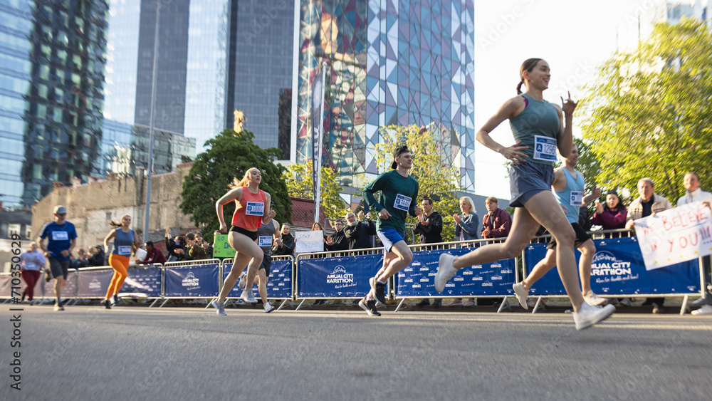 Foto de Diverse Group of People Running a Marathon in a City During the ...