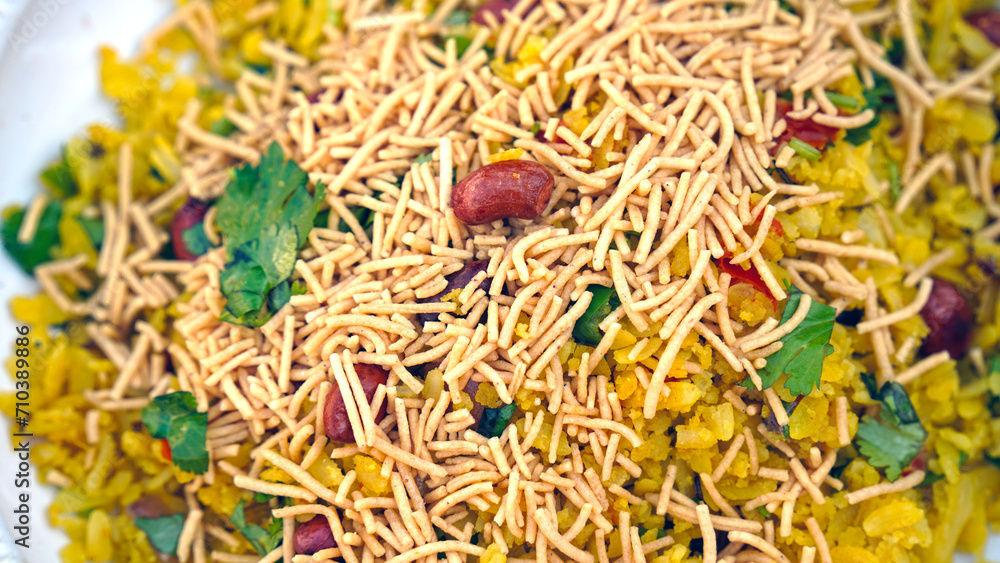 indian breakfast dish poha.Indian breakfast Poha topped with peanuts ...