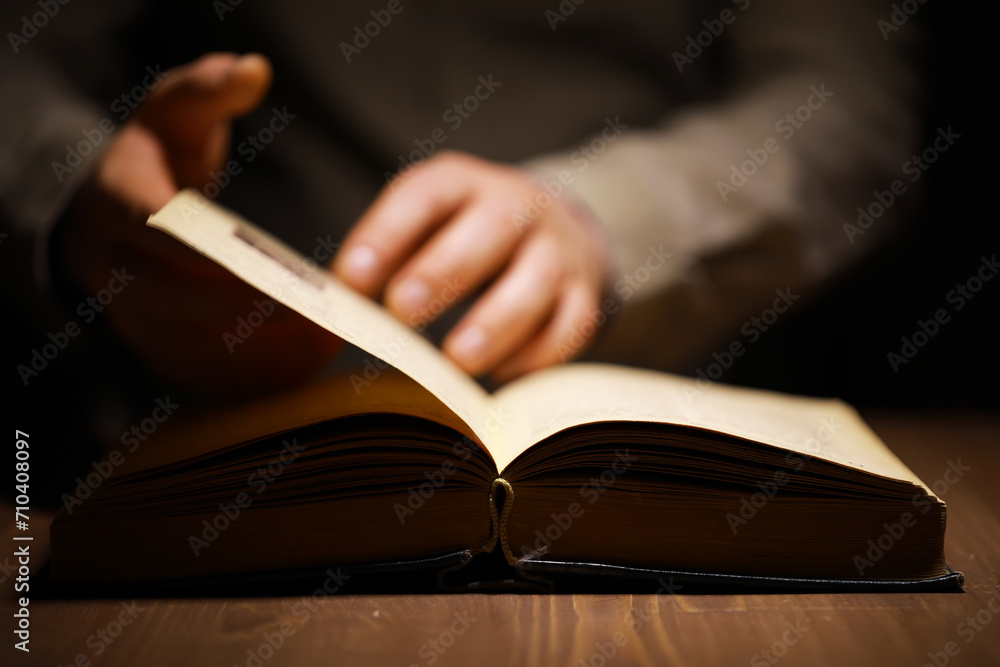 Man holding an open book with two hands. Concept of learning, education ...