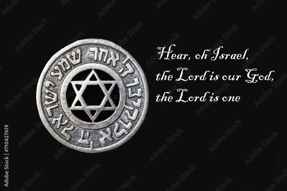 Silver medallion with the Star of David and the Shema Israel prayer in ...