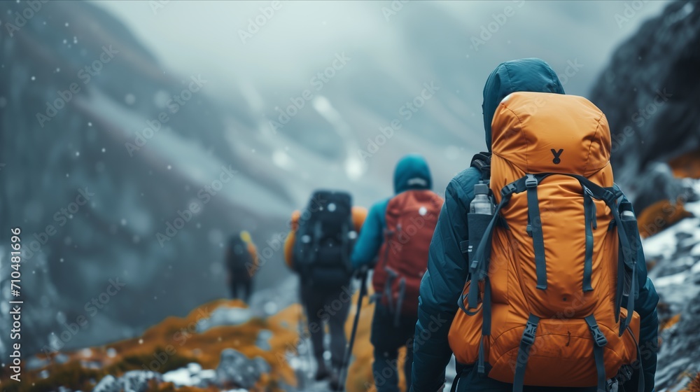 Hikers trekking and walking through a beautiful mountain range showing ...