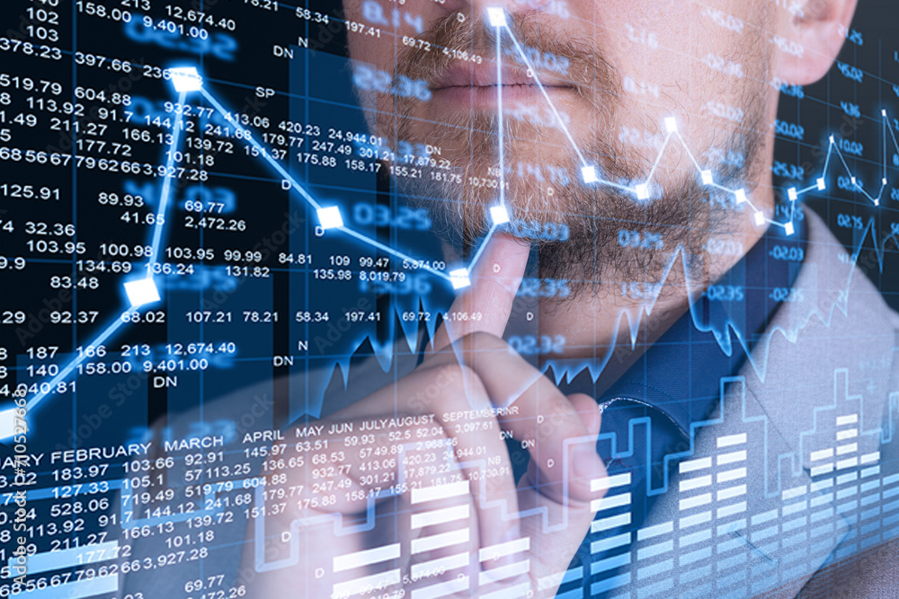 Businessman, broker analyzing stock market changes, falling and rising numbers and lines on the ...