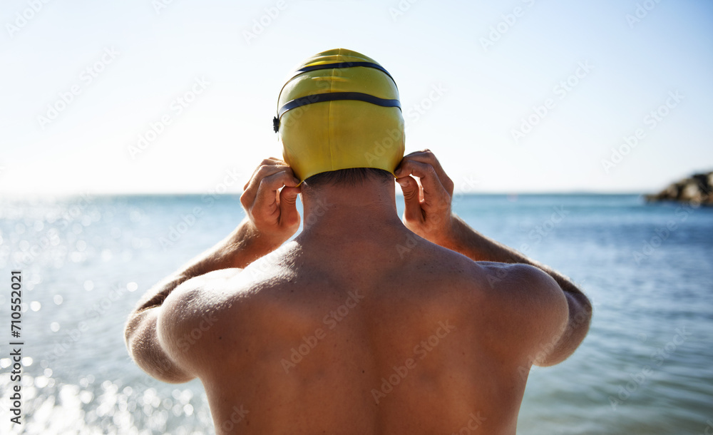 Sports, ocean and back of man for swimming exercise, workout or ...