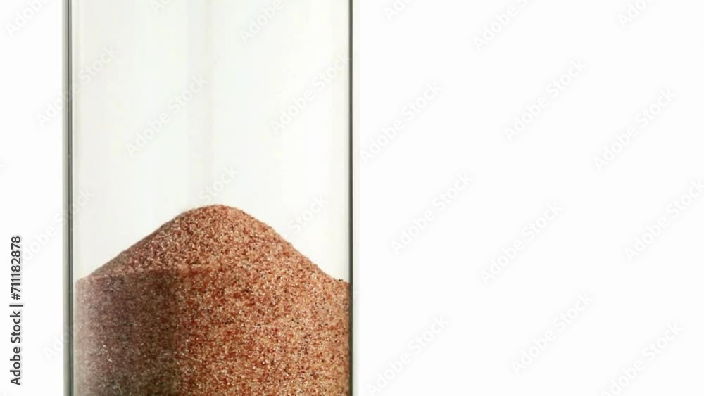 Vidéo Stock A shot of sands falling through a sand timer. Sand-glass ...