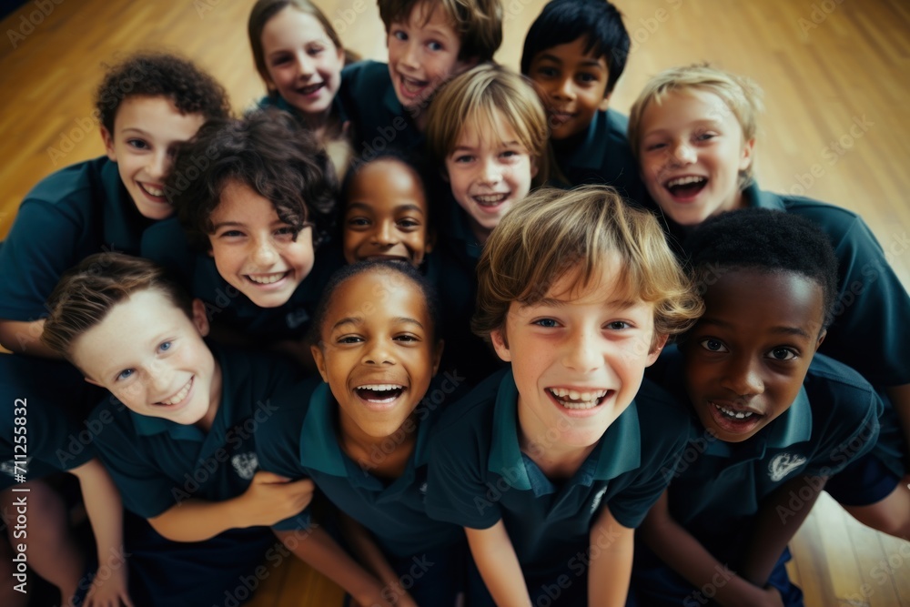 large group of children in NZ in school hall. from perspective looking ...