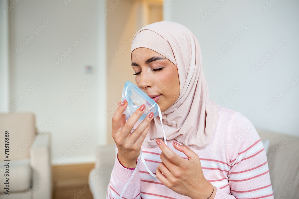 Sick Muslim woman with hijab on oxygen mask inhalation, pneumonia ...
