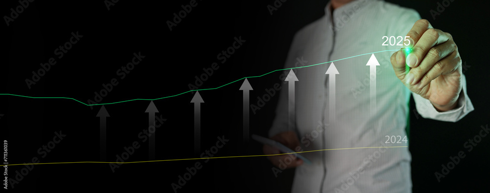 Happy new year 2025. A man with a stylus elevates or shifts the green ...