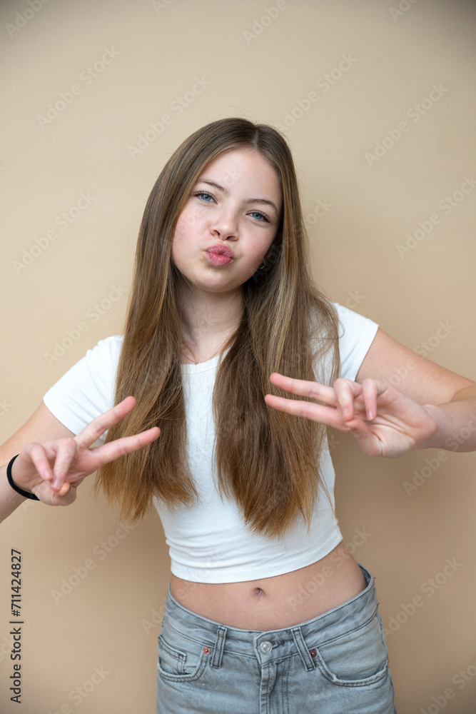 beautiful, cool, cute tween, teenager girl with long hair is posing in ...