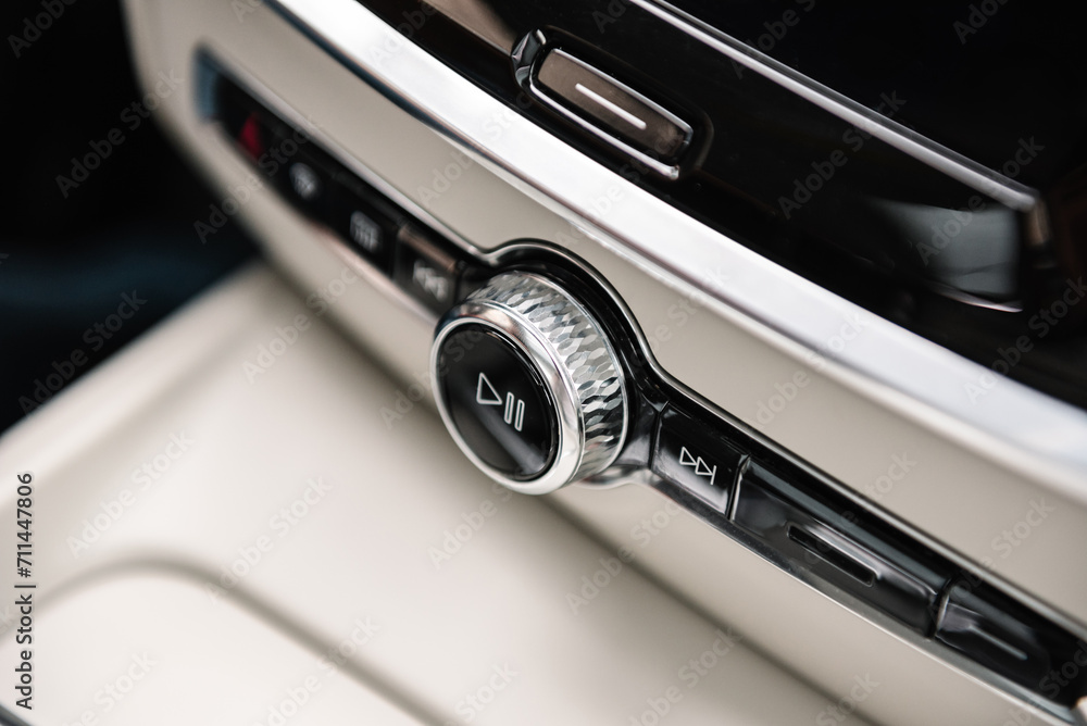 Modern panel in new car. Console with buttons on car panel. On-board ...