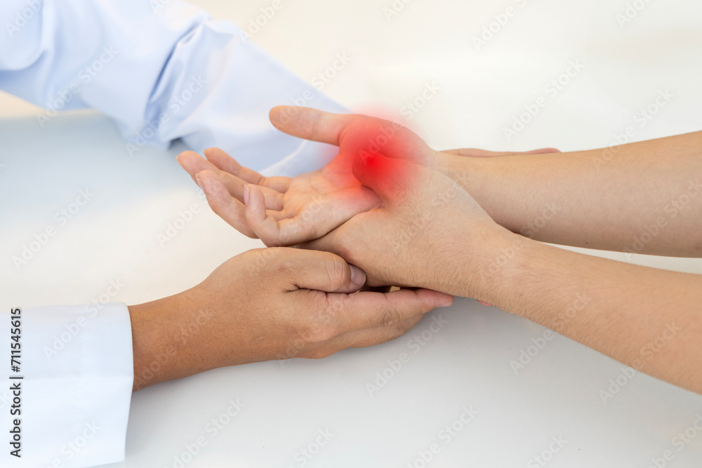 The orthopedic doctor or surgeon in uniform examined the patient with ...