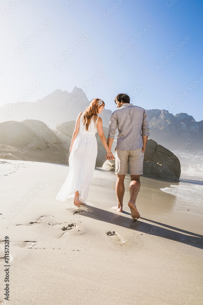 Couple getting married on the beach, boho style wedding, with loads of ...