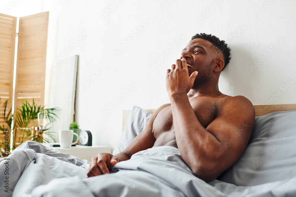 happy shirtless african american man with strong body waking up and ...
