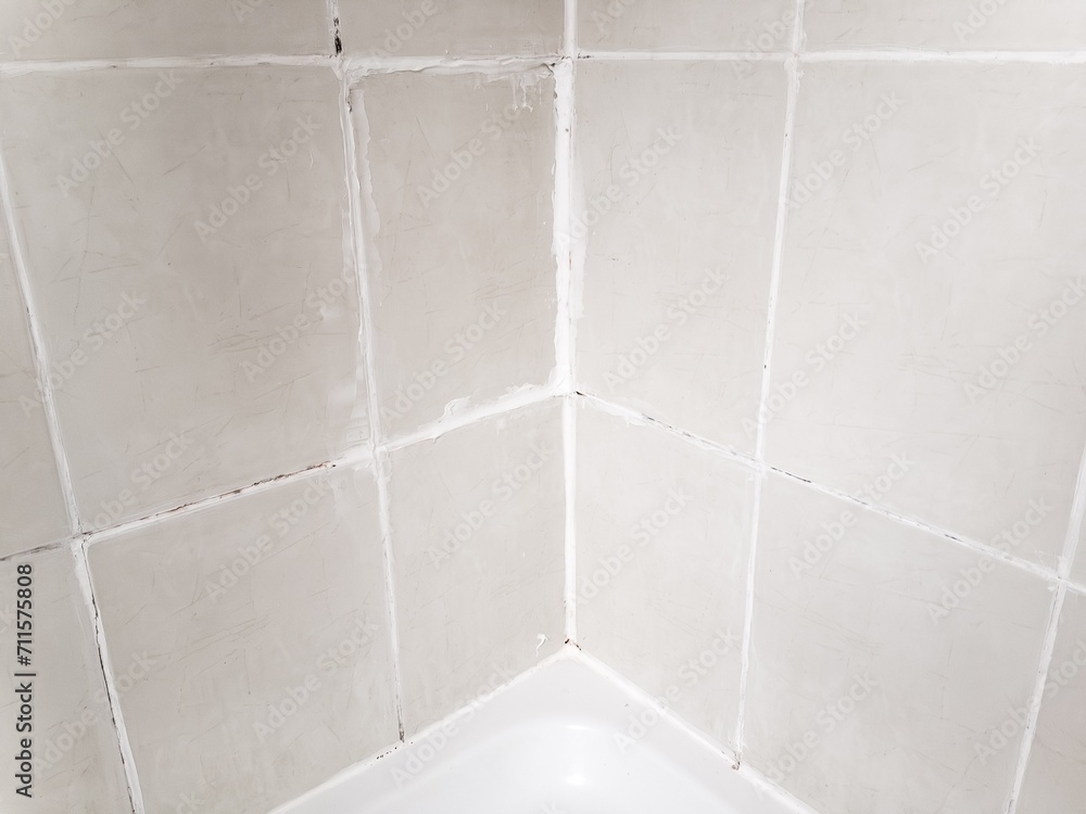 Poor build quality of tiles inside a house Stock Photo | Adobe Stock