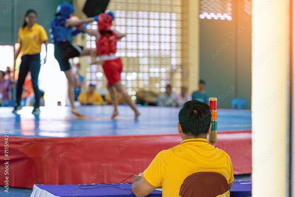 Back view of Judges work during Wushu Boxing Cup among young women ...
