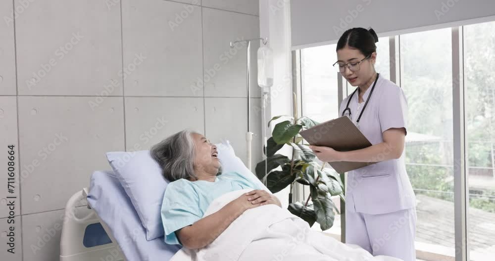 nurse takes care elderly Asian female patient checking and inquiring ...