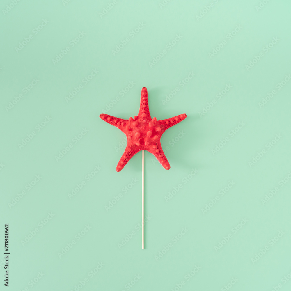 Trendy summer layout made with red starfish with lollipop stick on ...